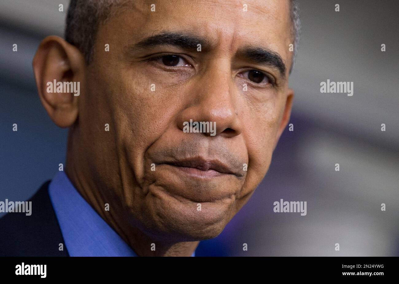 President Barack Obama pauses while speaking in the Brady Press ...