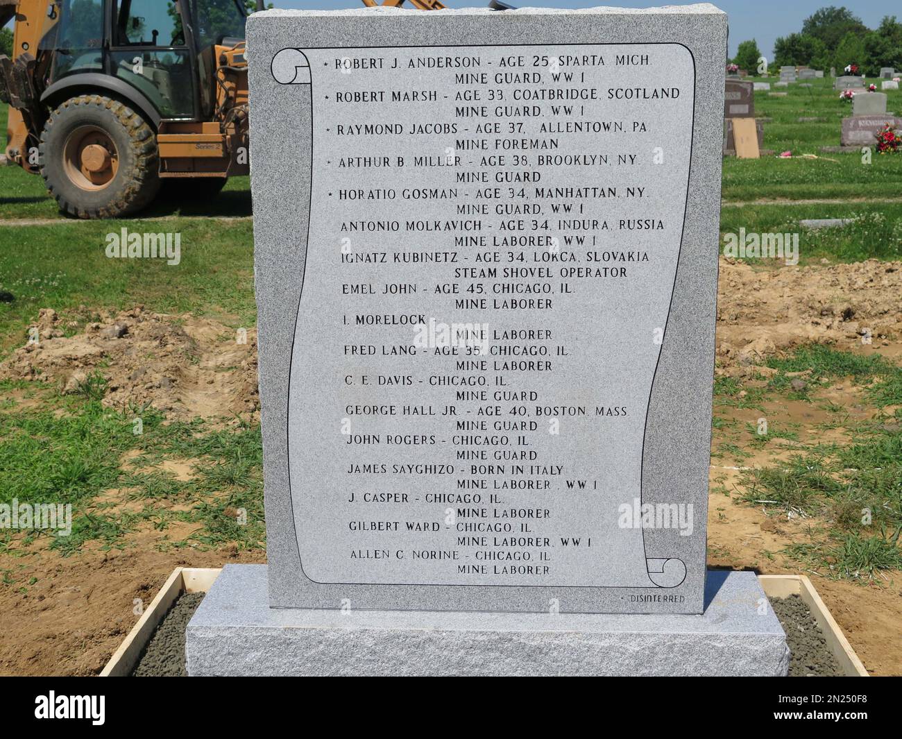 In this June 10, 2015 photo, a newly installed burial marker at the ...