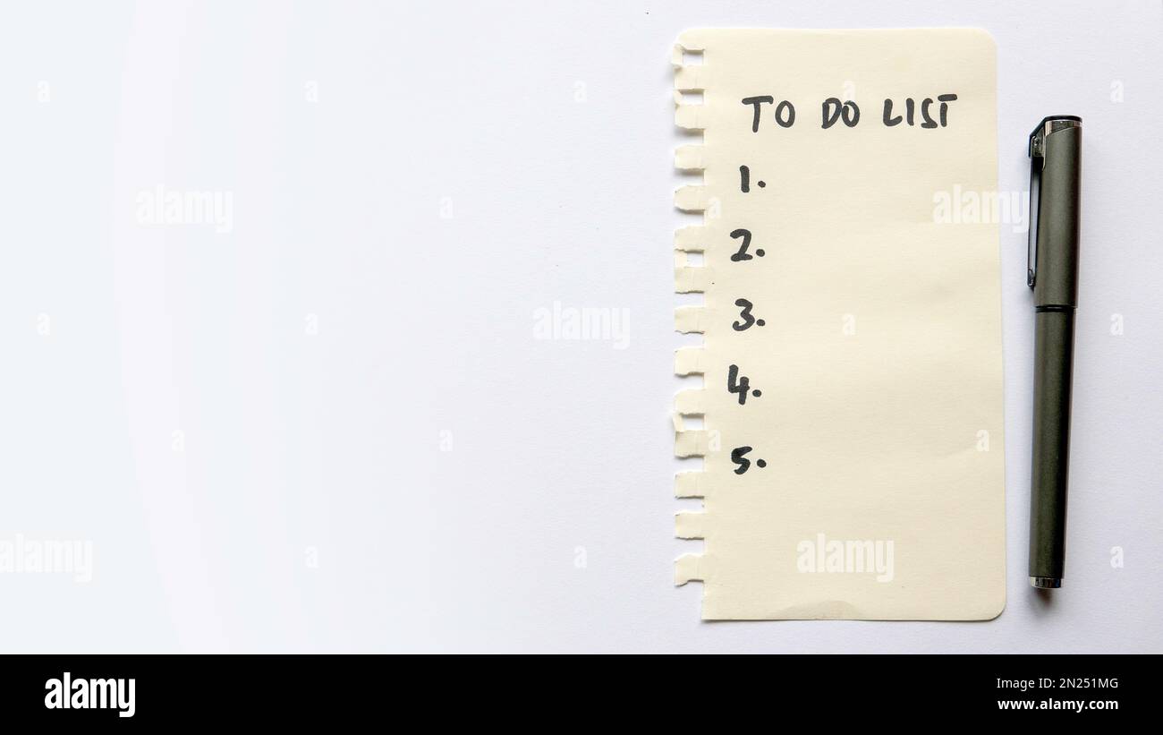 A list of to do list written on a piece of paper with pen on white ...