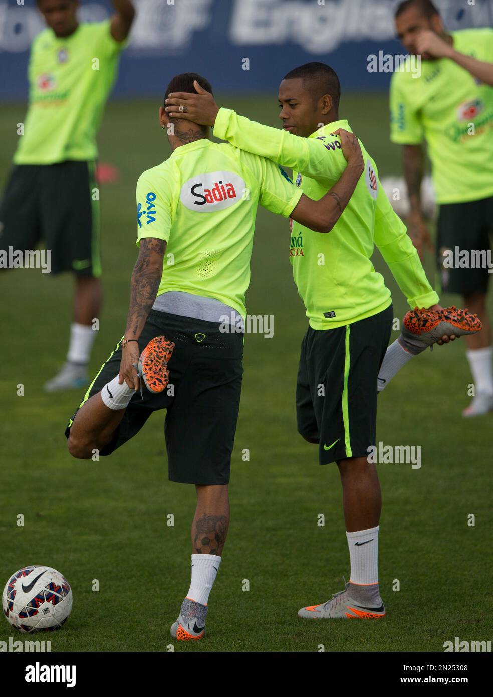 Brazil's soccer players Robinho, right, and Neymar stretch during a ...