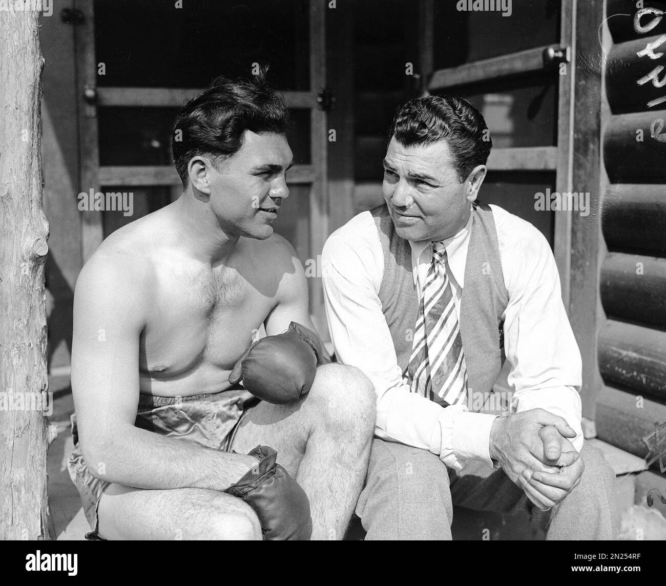 Max Schmeling, left, German heavyweight, gets a few pointers from the ...