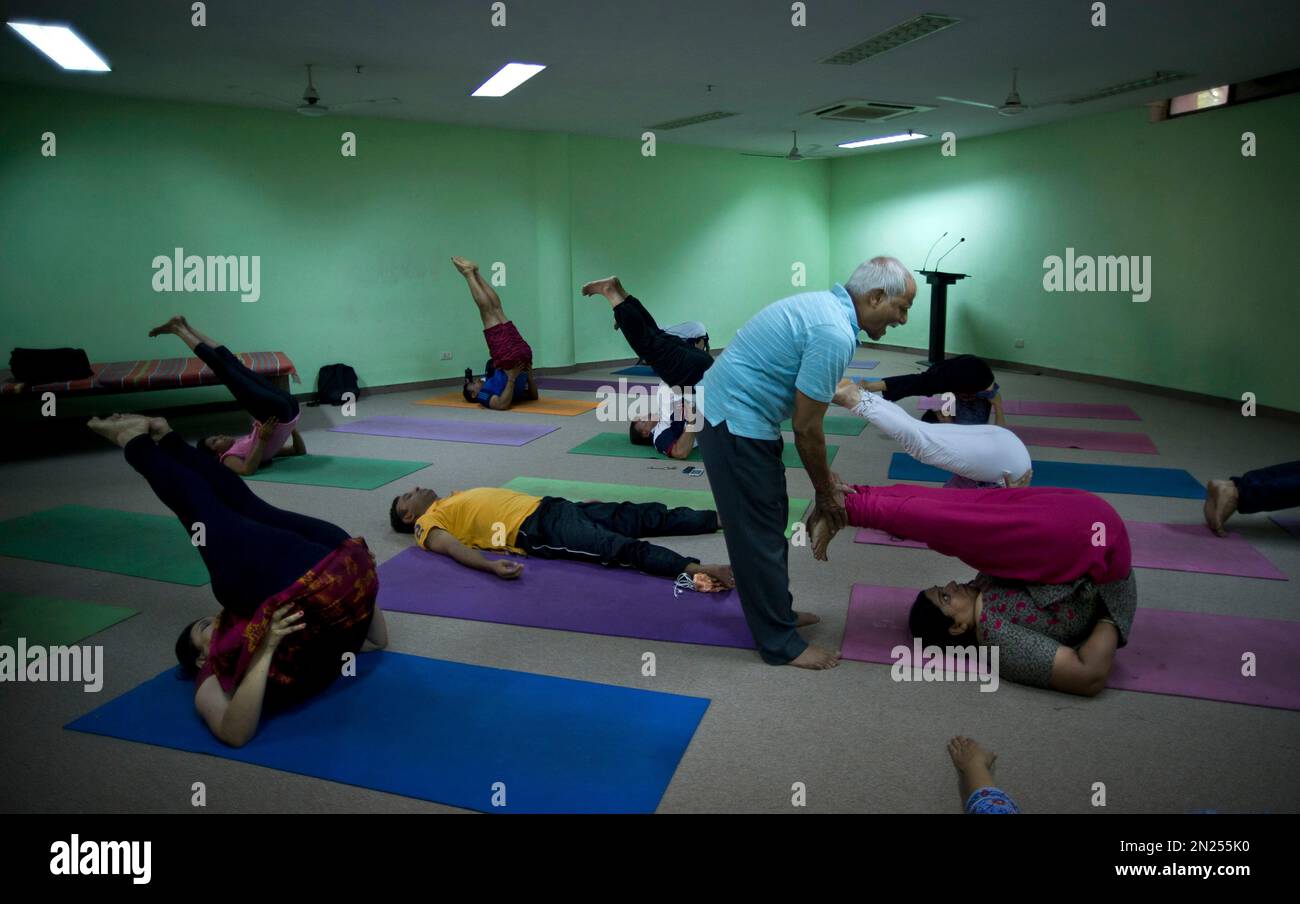 In this Thursday, June 18, 2015, photo, Indian perform Yoga at the ...