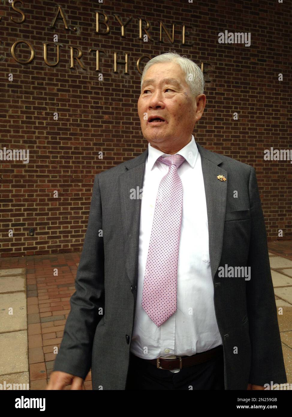 Han Tak Lee stands outside the Federal Courthouse in Philadelphia ...
