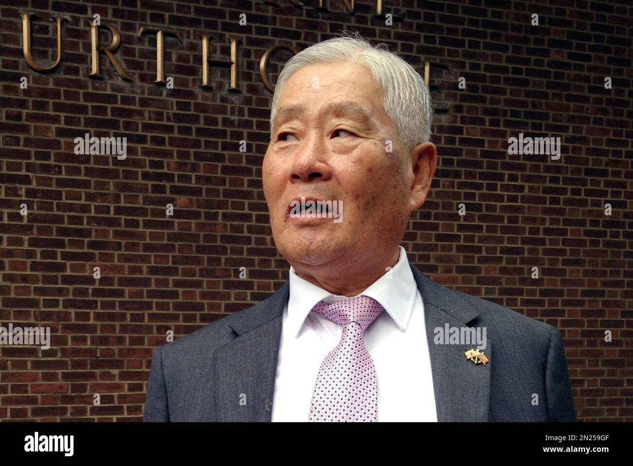 Han Tak Lee stands outside the Federal Courthouse in Philadelphia ...