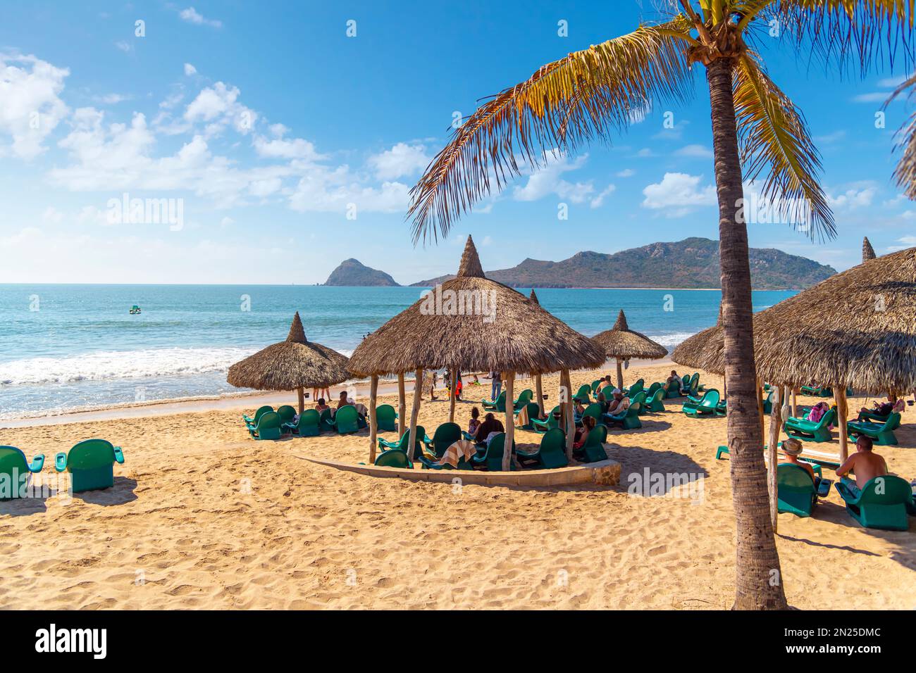 An oceanfront resort offers private huts and cabanas along the sandy ...