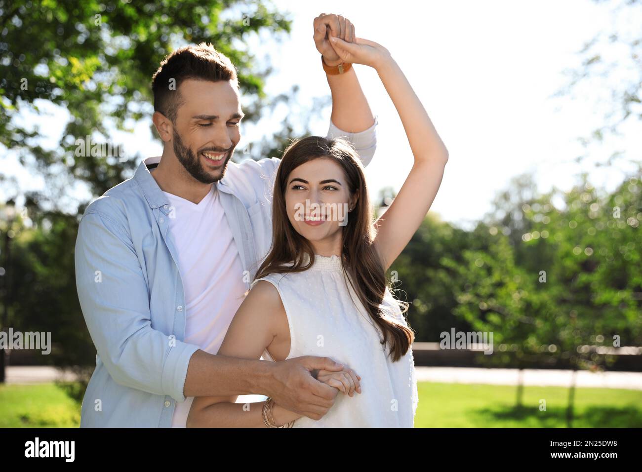 Passionate couple dancing outdoors cute hi-res stock photography and ...