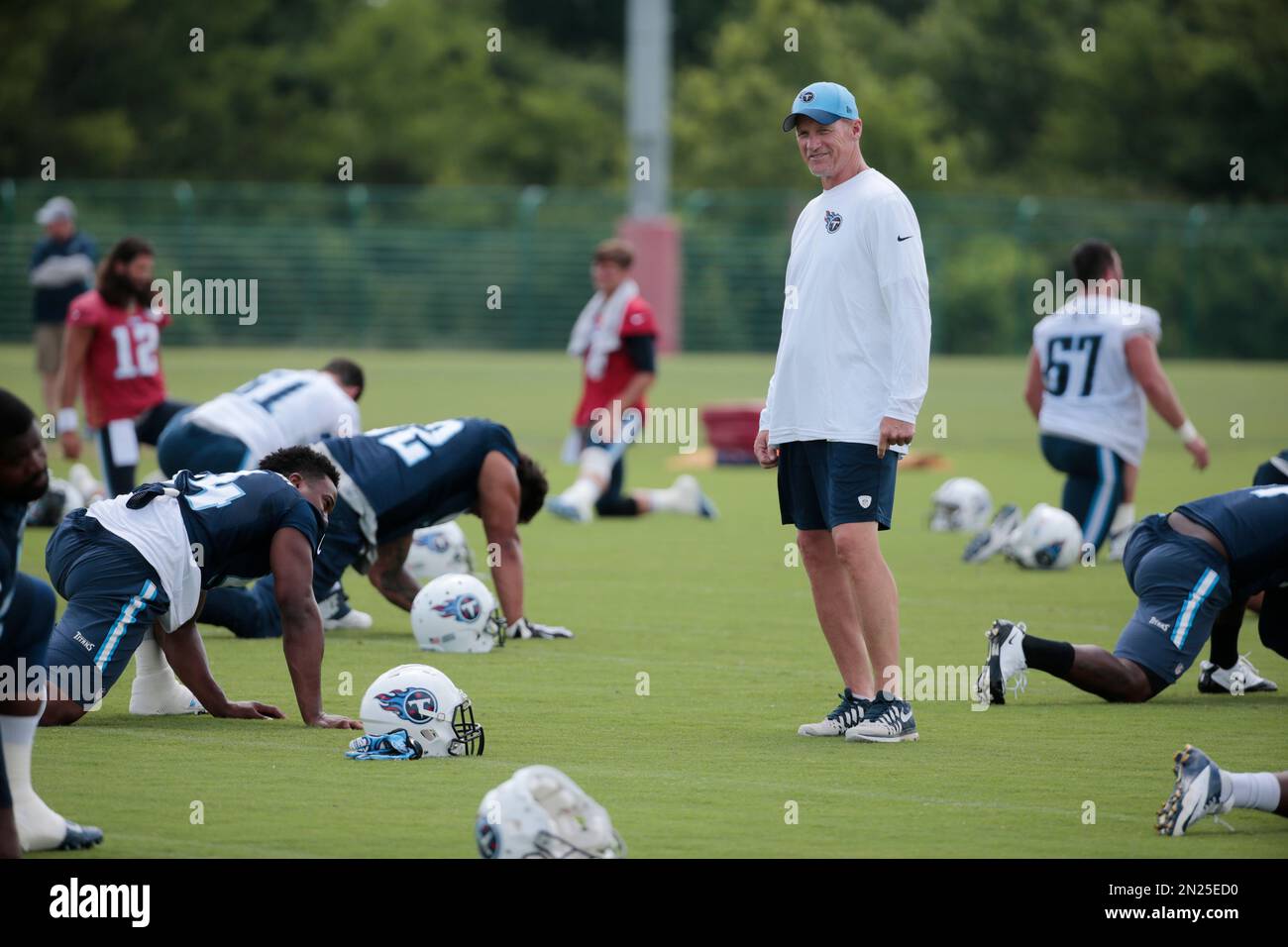 Tennessee Titans head coach Ken Whisenhunt talks with players as they ...