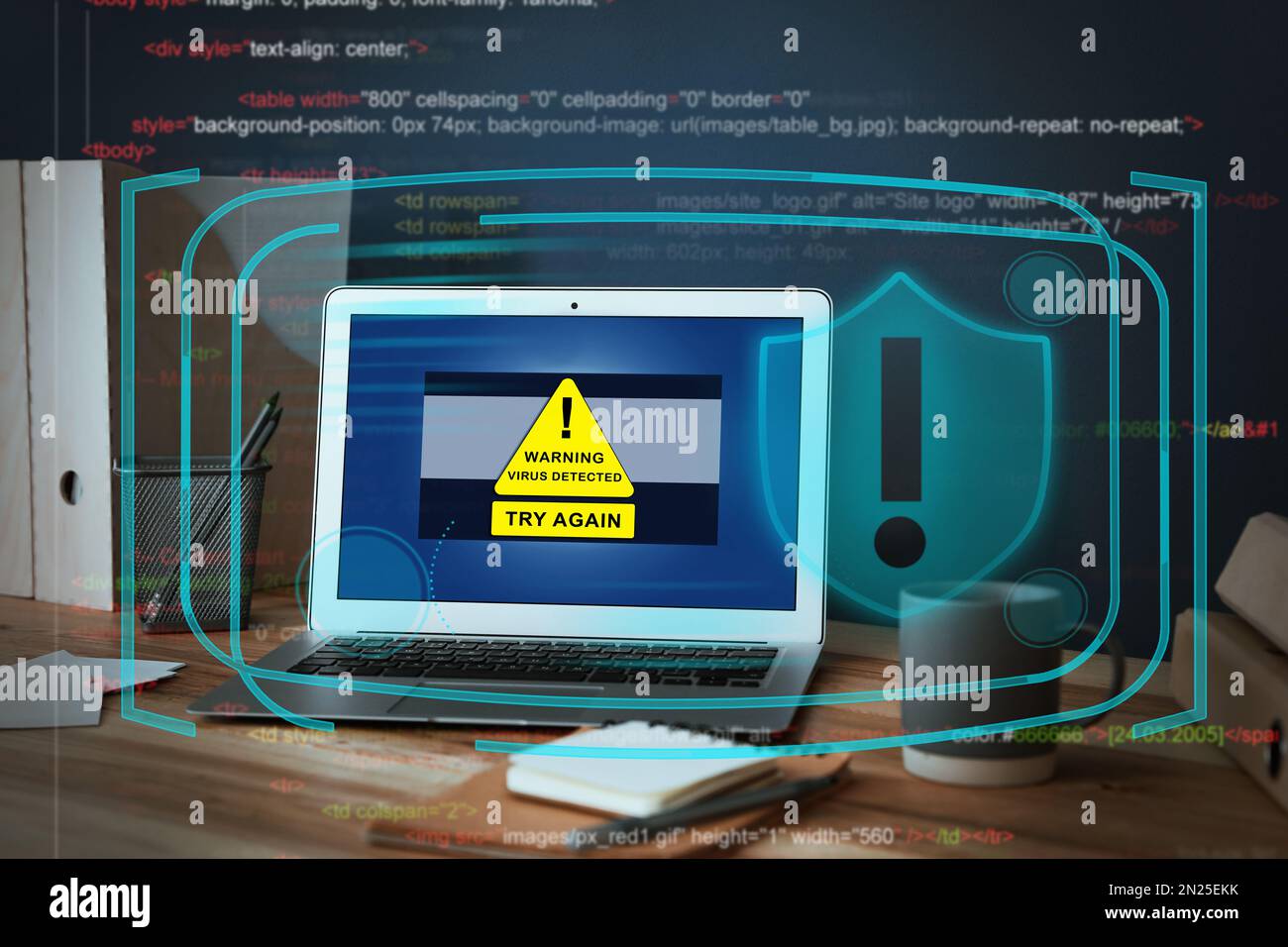 Warning about virus attack on laptop screen. Workplace in office Stock ...