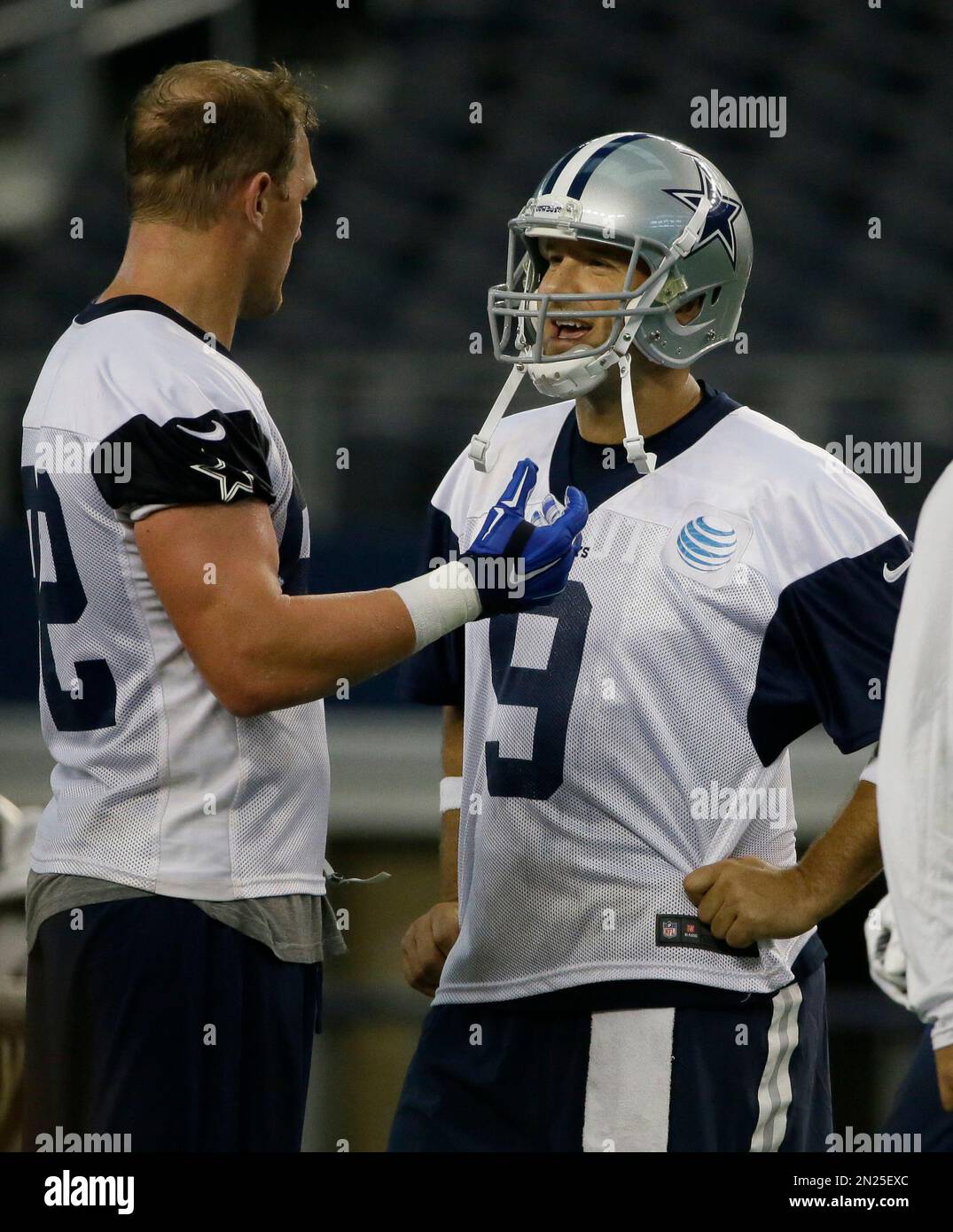 Dallas Cowboys tight end Jason Witten (82) talks with quarterback Tony ...
