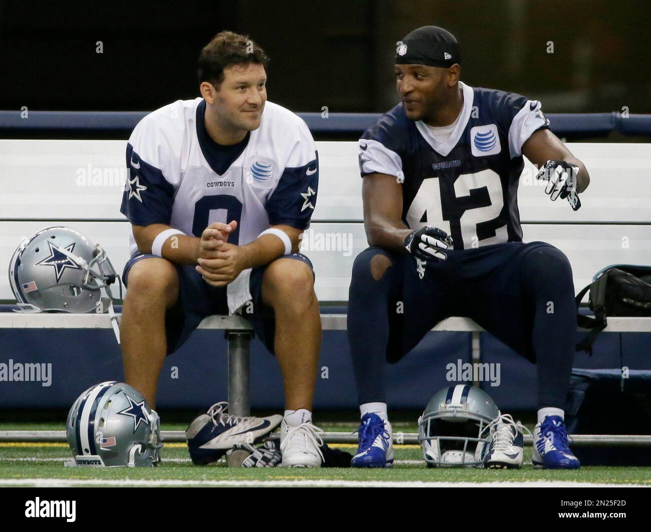 Dallas Cowboys quarterback Tony Romo (9) chats with safety Barry Church ...