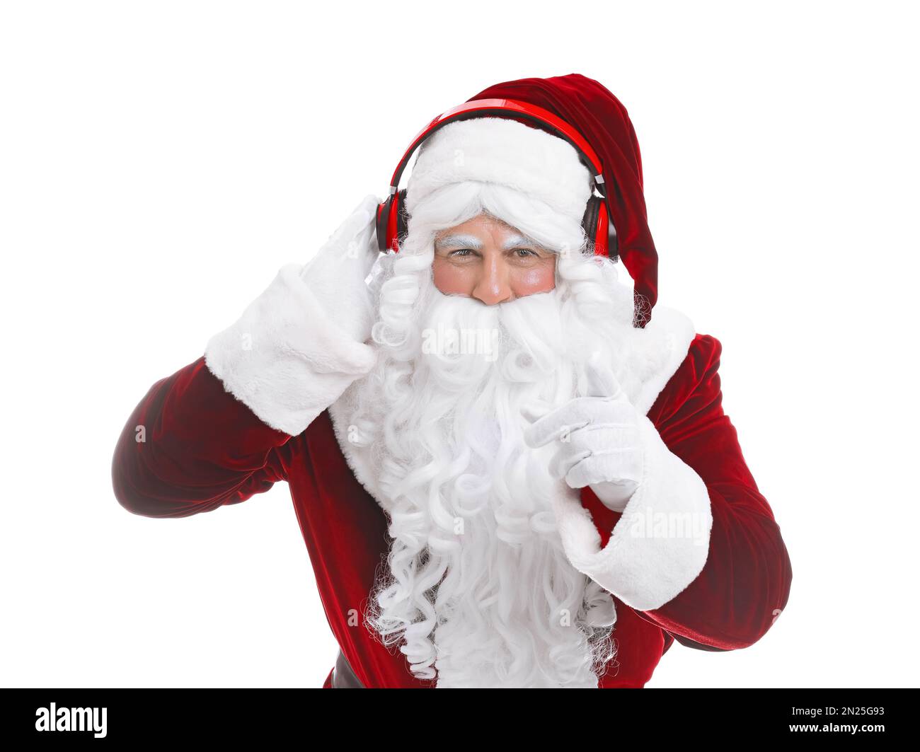 Santa Claus with headphones listening to Christmas music on white ...