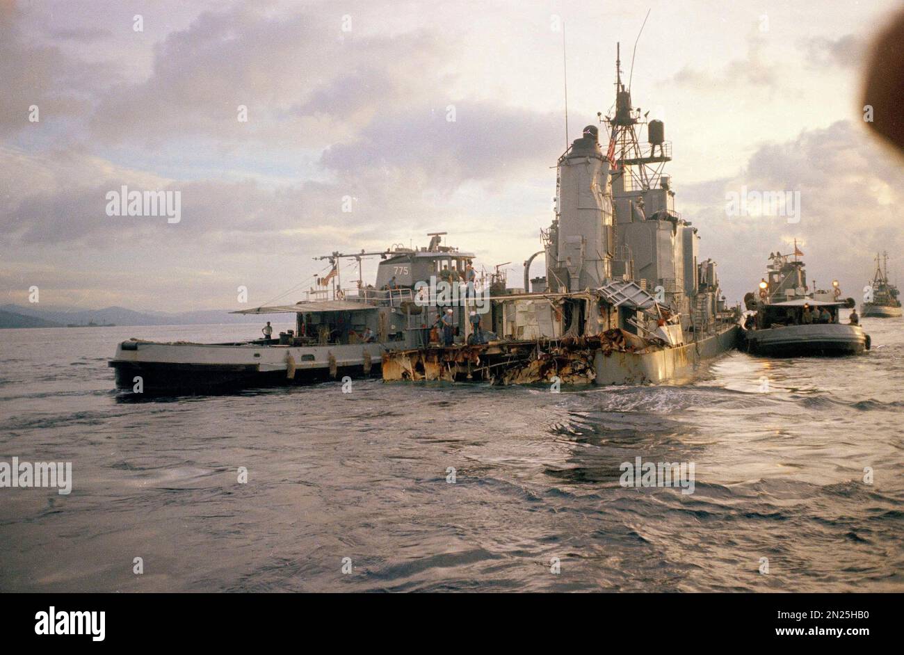 Sailors inspect damage to the U.S. Navy destroyer USS Frank E. Evans ...