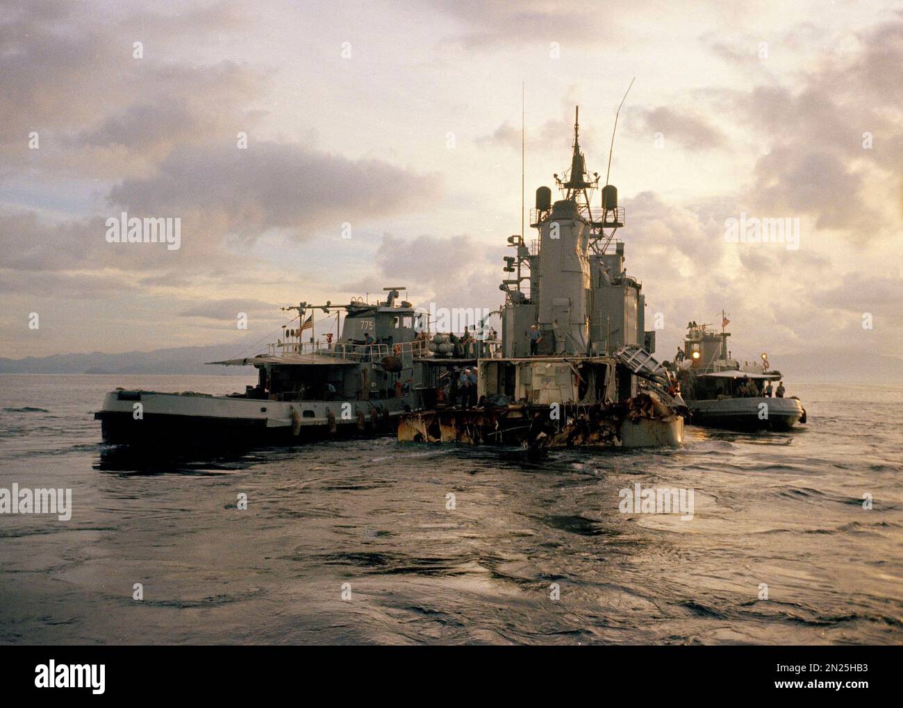 Sailors inspect damage to the U.S. Navy destroyer USS Frank E. Evans ...