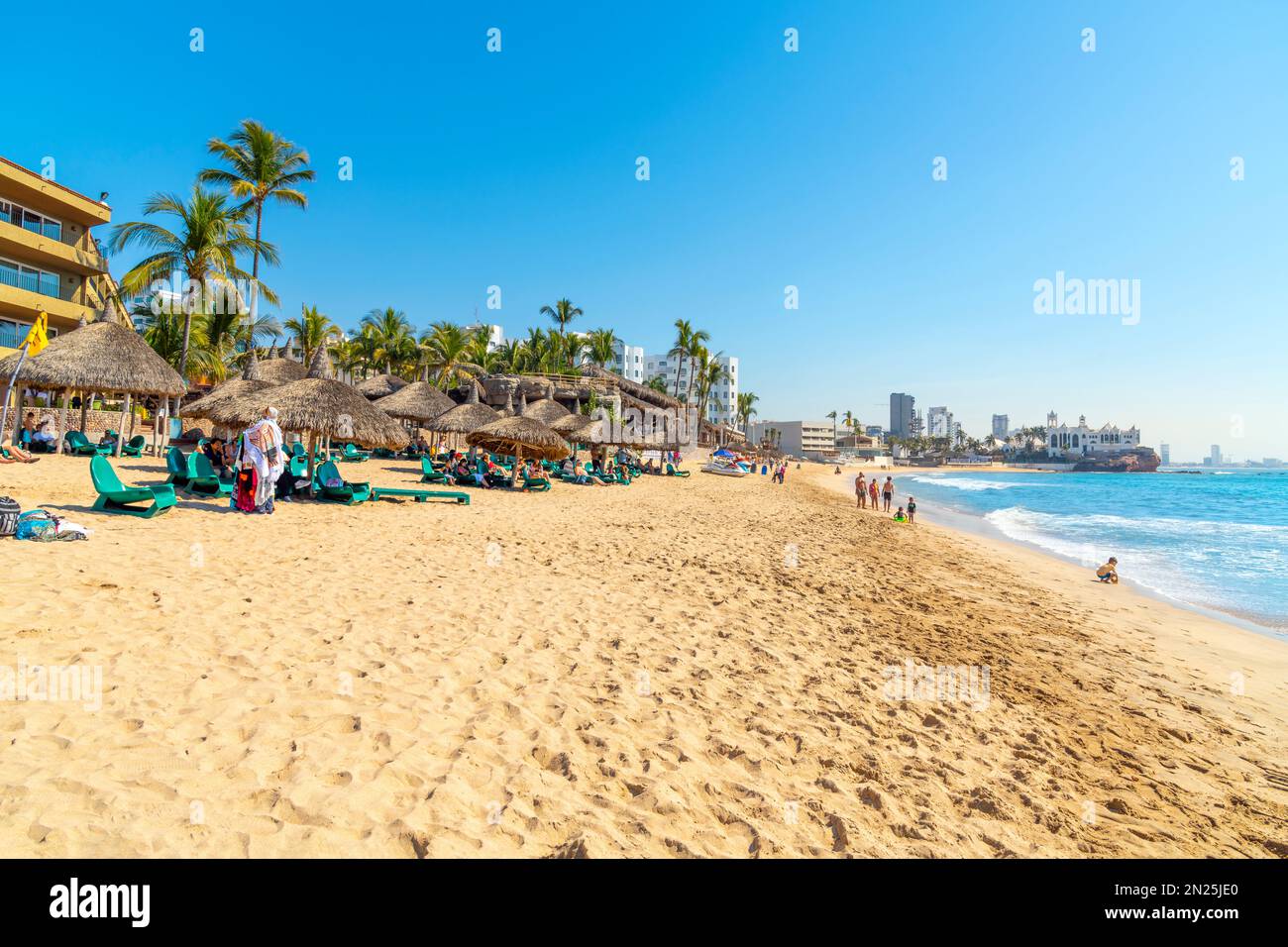 An oceanfront resort offers private huts and cabanas along the sandy ...