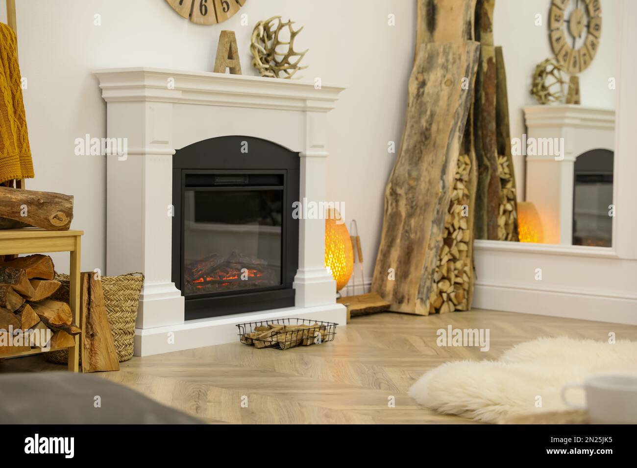 Elegant fireplace with burning flame in contemporary room interior ...