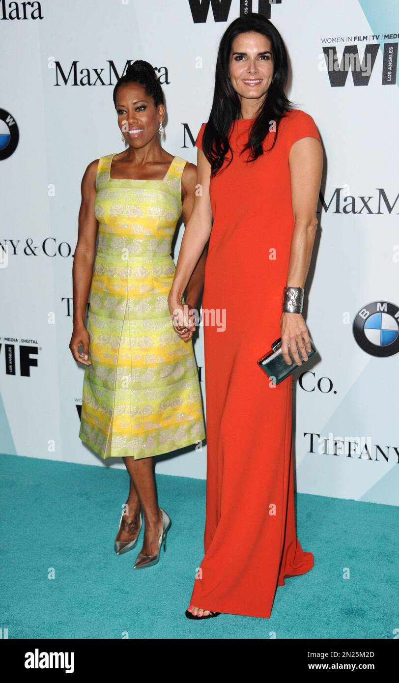 Regina King, left, and Angie Harmon arrive at the Women in Film 2015 ...