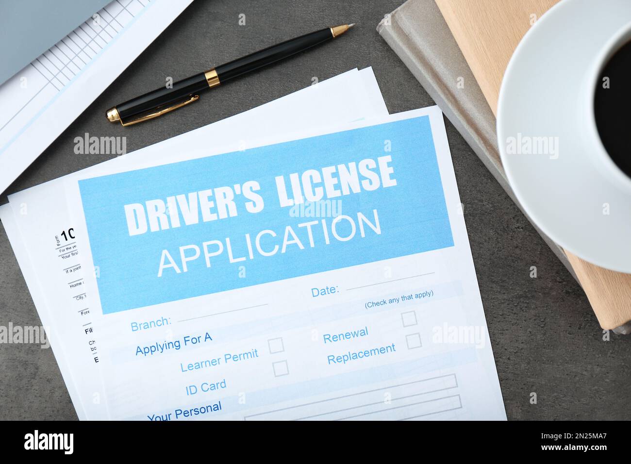 Driver's license application form and stationery on grey table, flat lay Stock Photo - Alamy