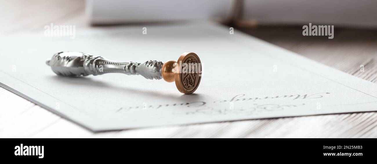 Vintage notary stamp and document on wooden table, closeup. Banner ...