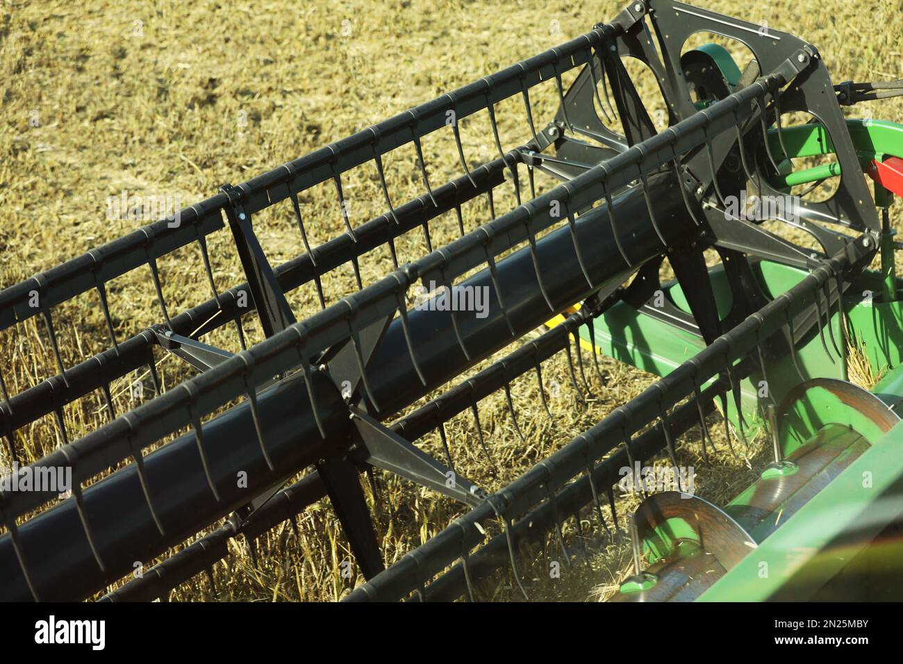 Modern combine harvester in agricultural field, closeup view of reel ...