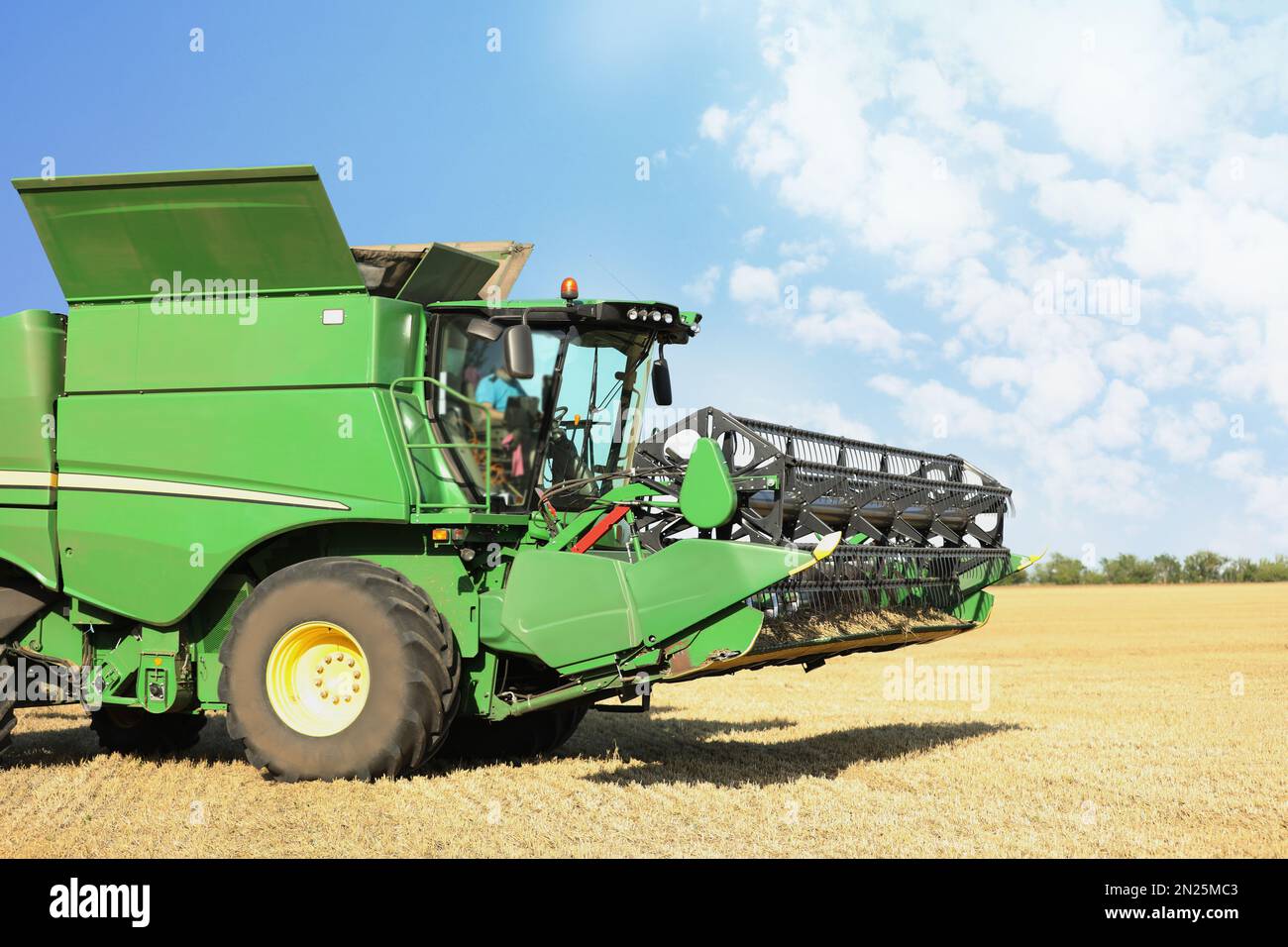 Modern combine harvester in field. Agricultural industry Stock Photo ...