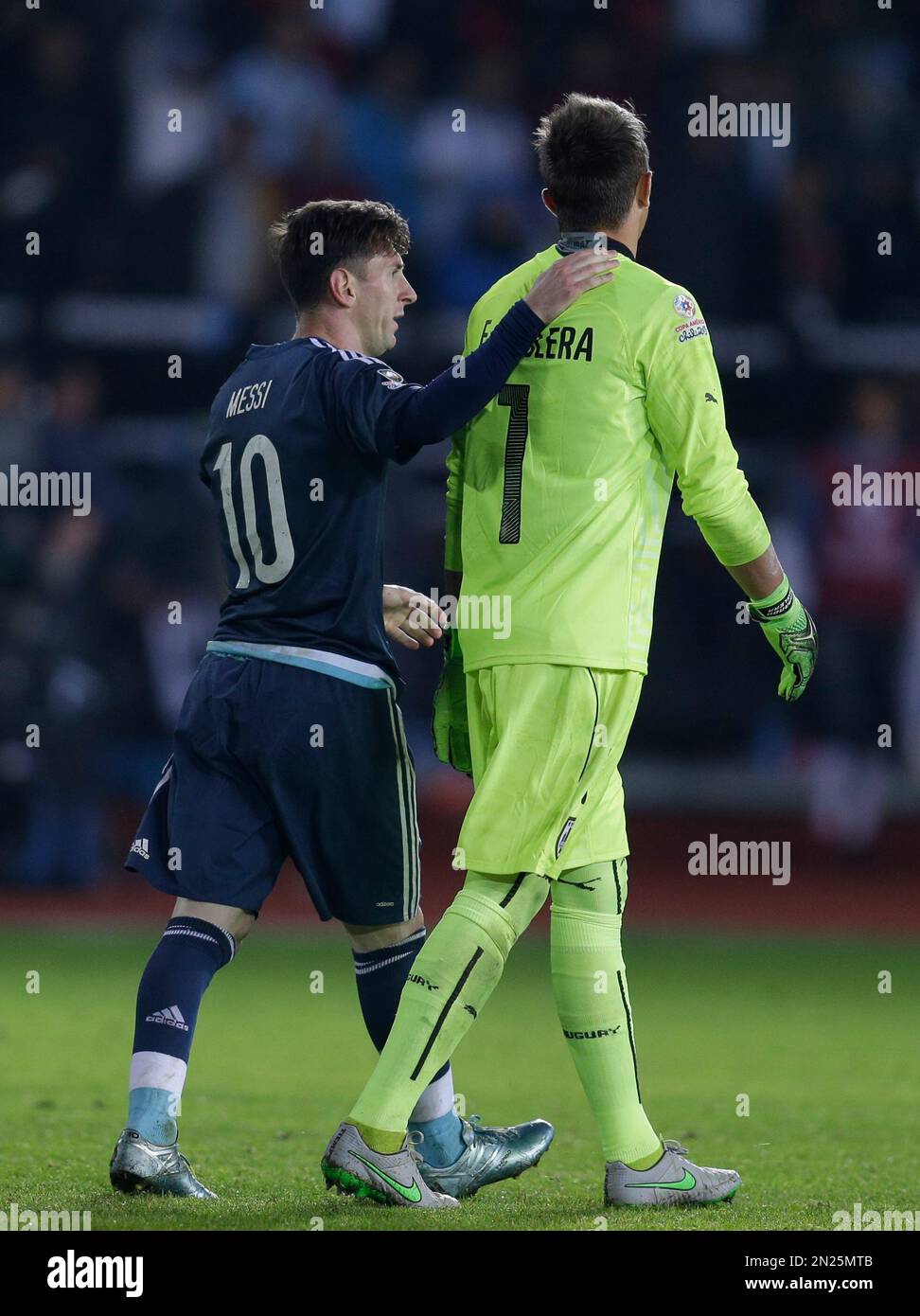 Argentina's Lionel Messi, left, comforts Uruguay's goalkeeper Fernando ...