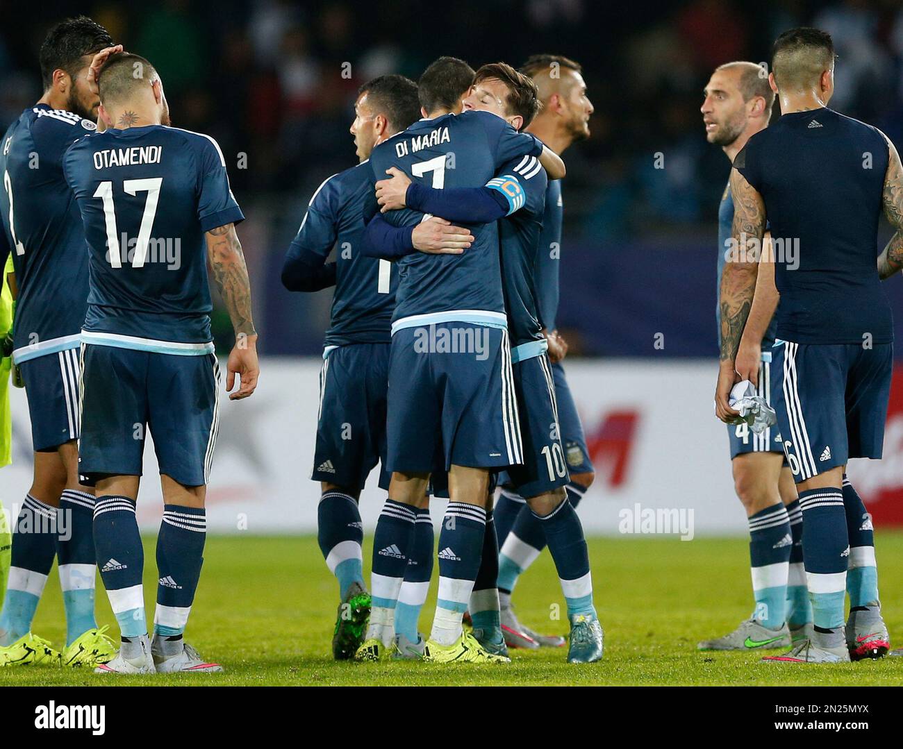 Argentina's Lionel Messi, center right, hugs teammate Angel Di Maria at ...