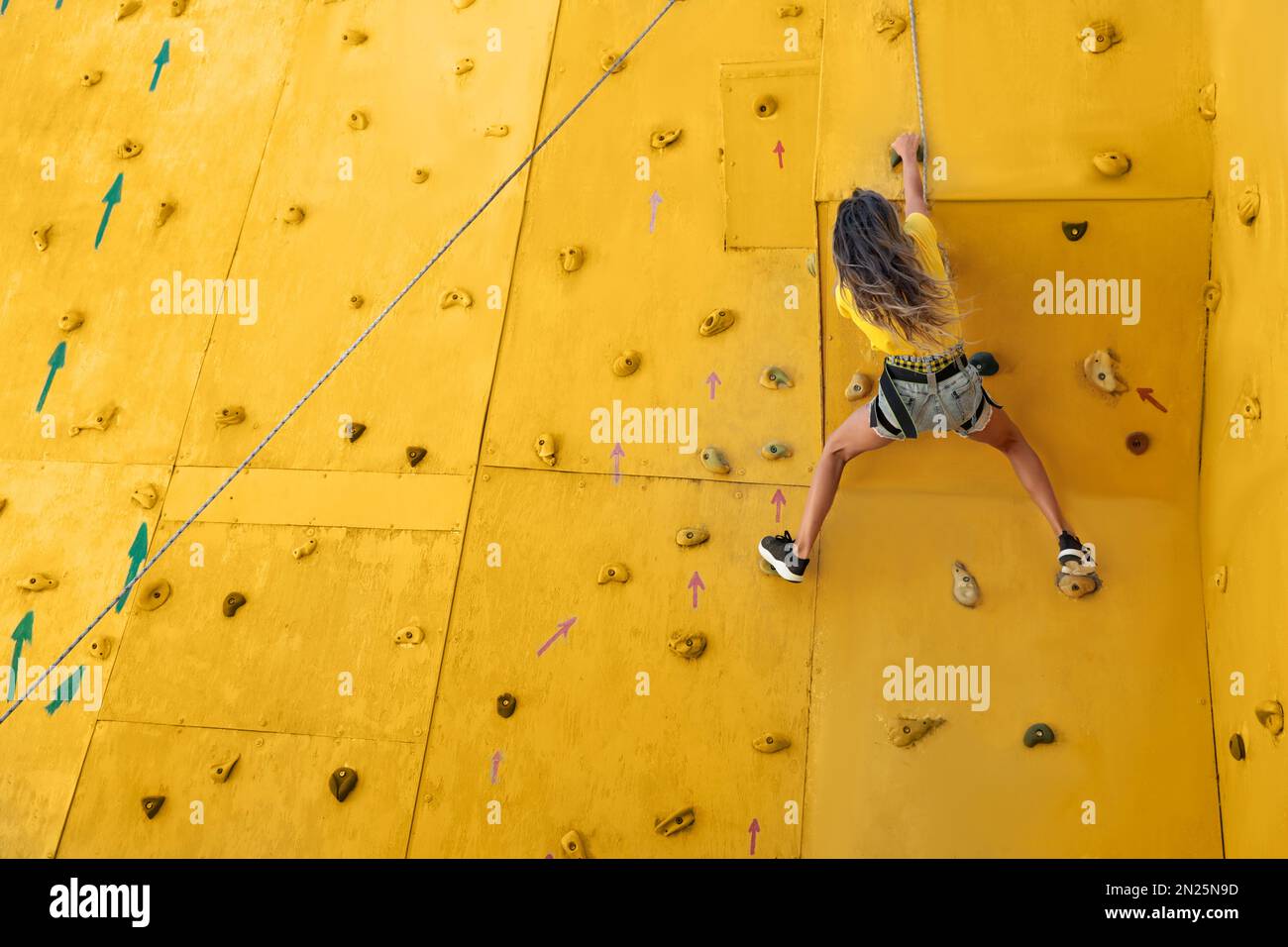 Girl on climbing wall hi-res stock photography and images - Alamy