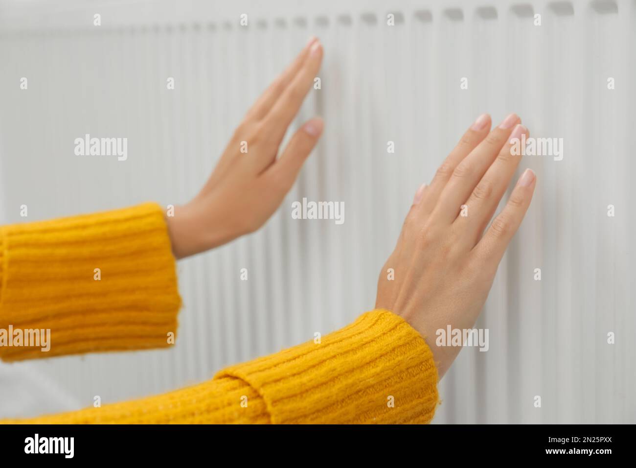 Female hands on radiator hi-res stock photography and images - Alamy