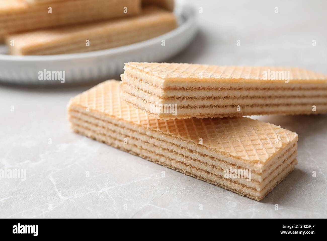 Delicious cream wafers on light grey marble table, closeup Stock Photo ...