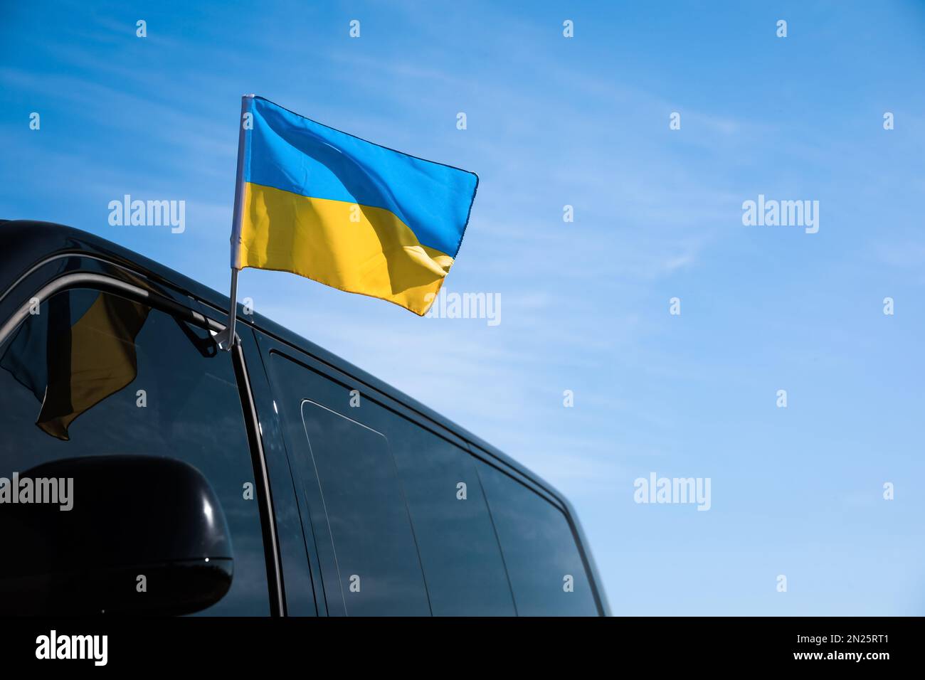 National flag of Ukraine on car window outdoors. Space for text Stock ...