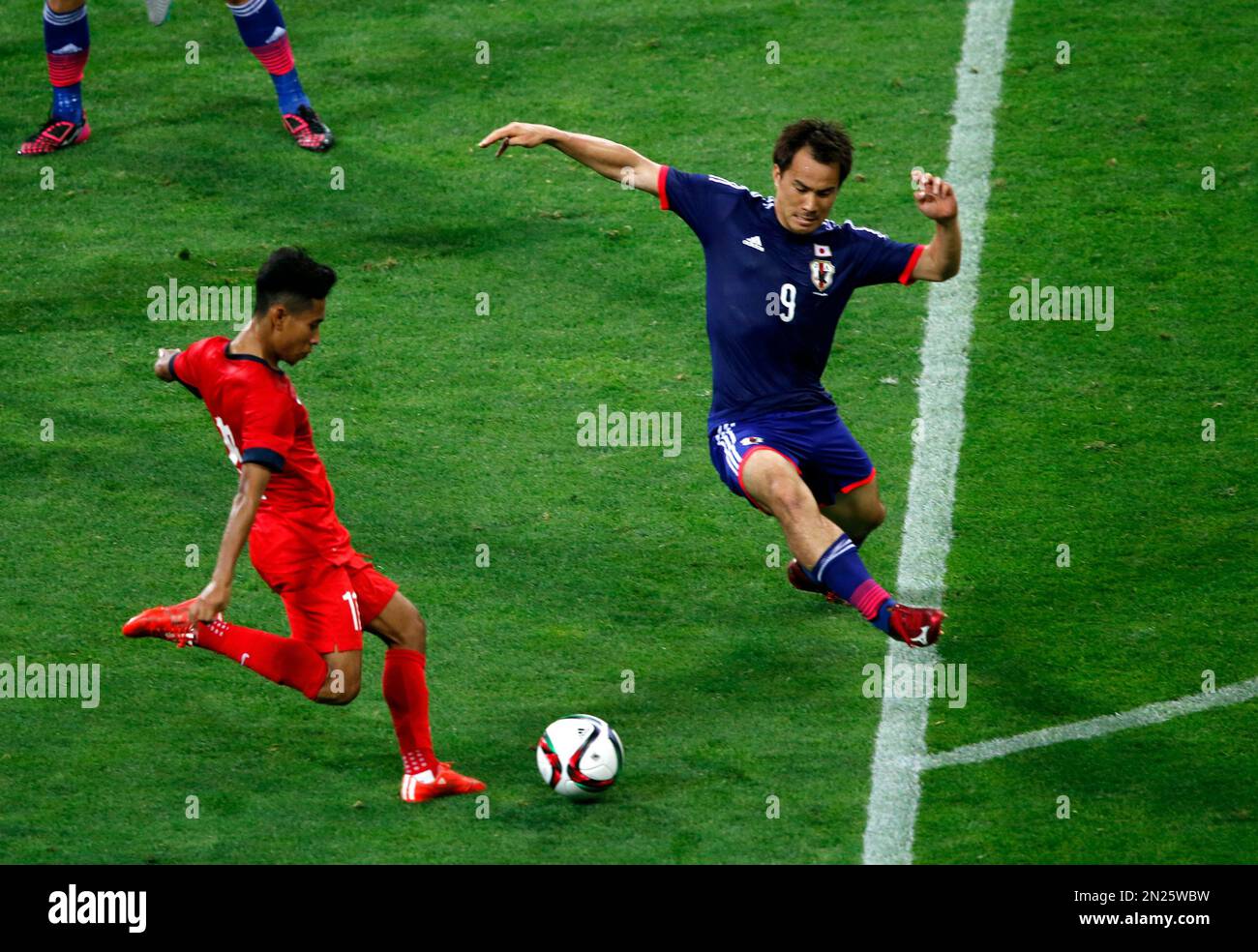 Japan’s Shinji Okazaki, right, and Singapore's Muhammad Nazrul Bin ...