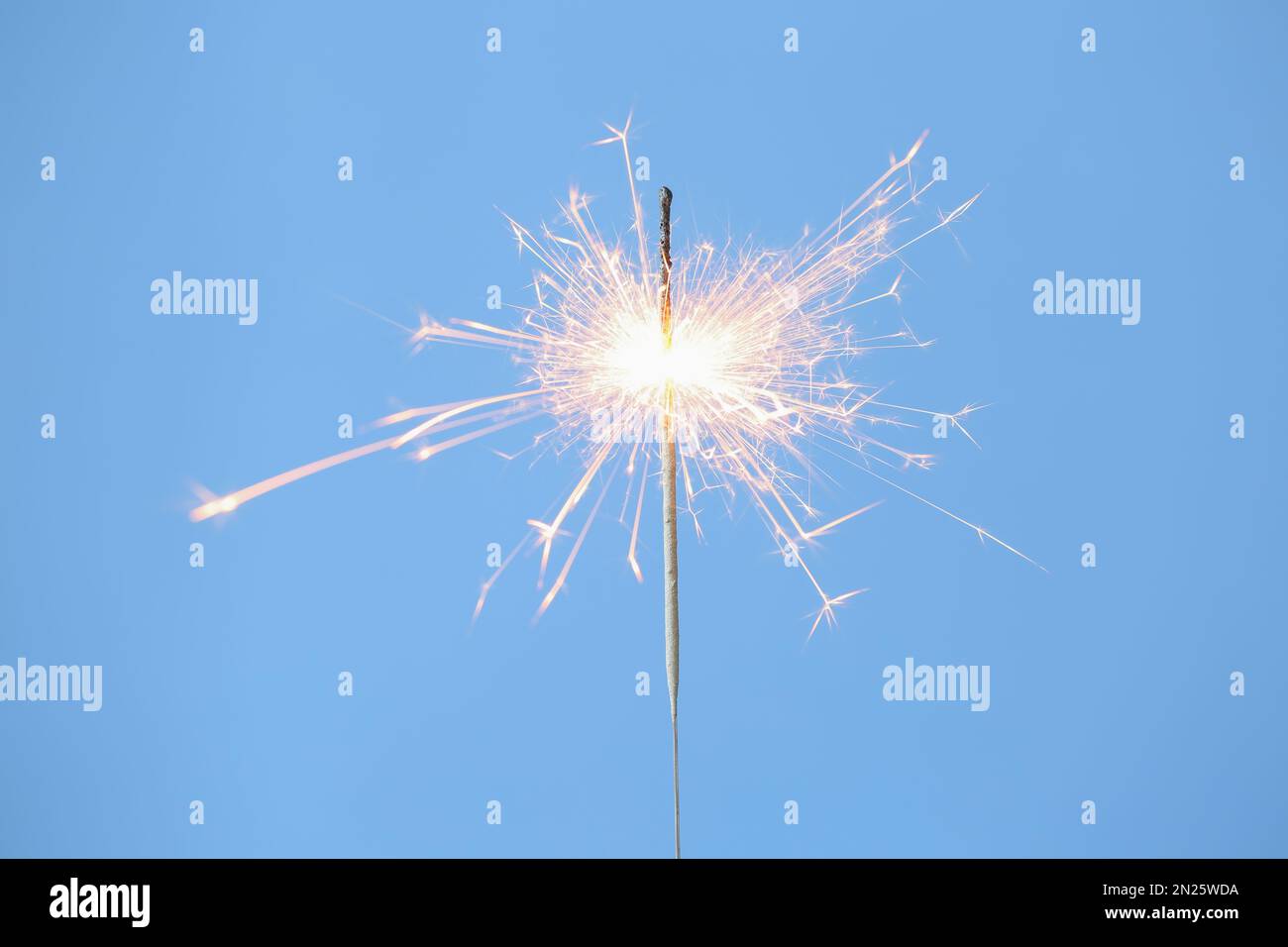 Bright sparkling sparkler on christmas hi-res stock photography and ...