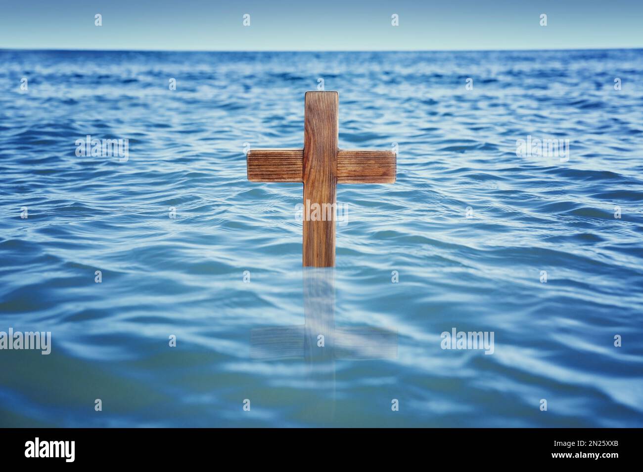 Wooden cross in river for religious ritual known as baptism Stock Photo ...