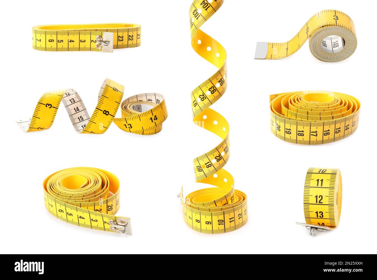 Set of yellow measuring tapes on white background Stock Photo - Alamy