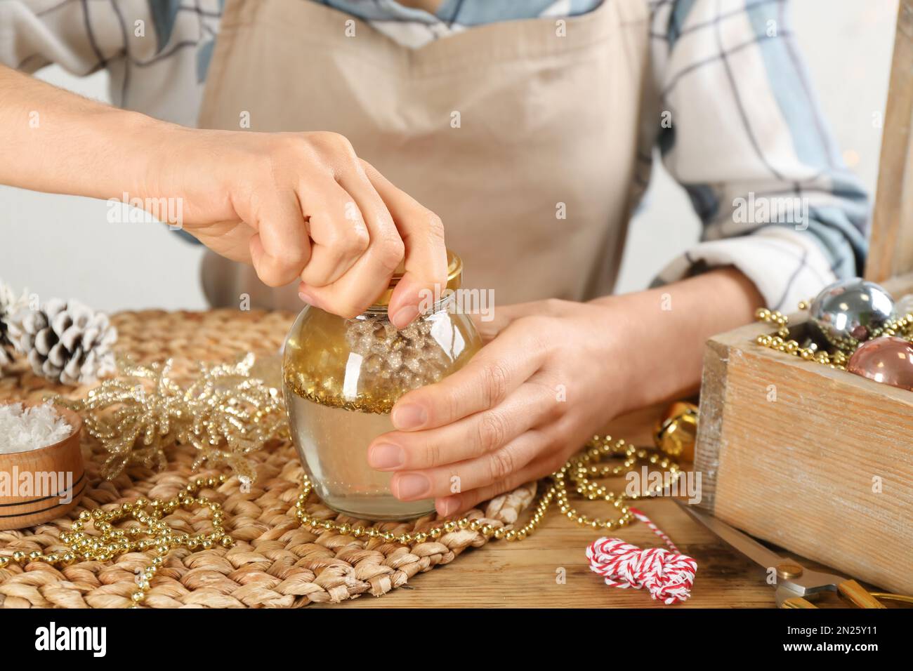 Woman making snow globe hi-res stock photography and images - Alamy