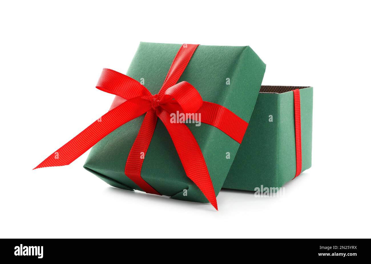 Christmas gift box decorated with red bow isolated on white Stock Photo ...
