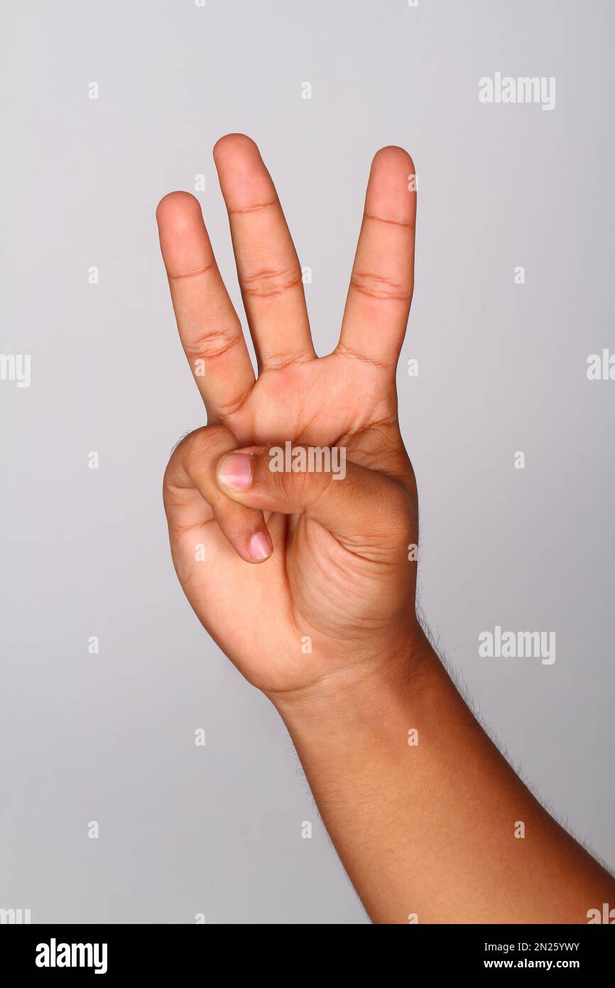 Young Man Hand shows number Three , Number Three index finger isolated ...