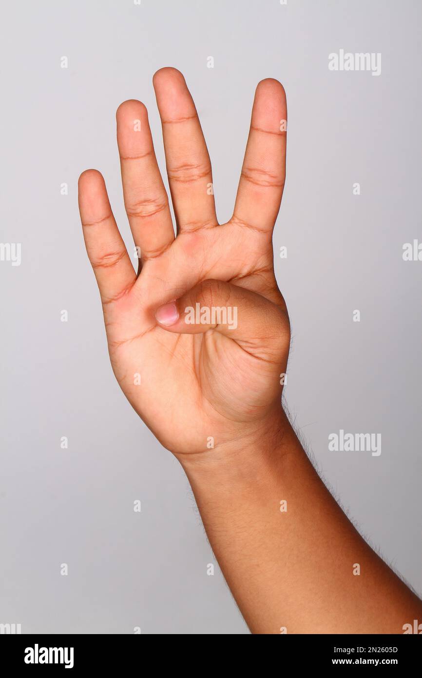 Young Man Hand shows number Four , Number Four index finger isolated ...