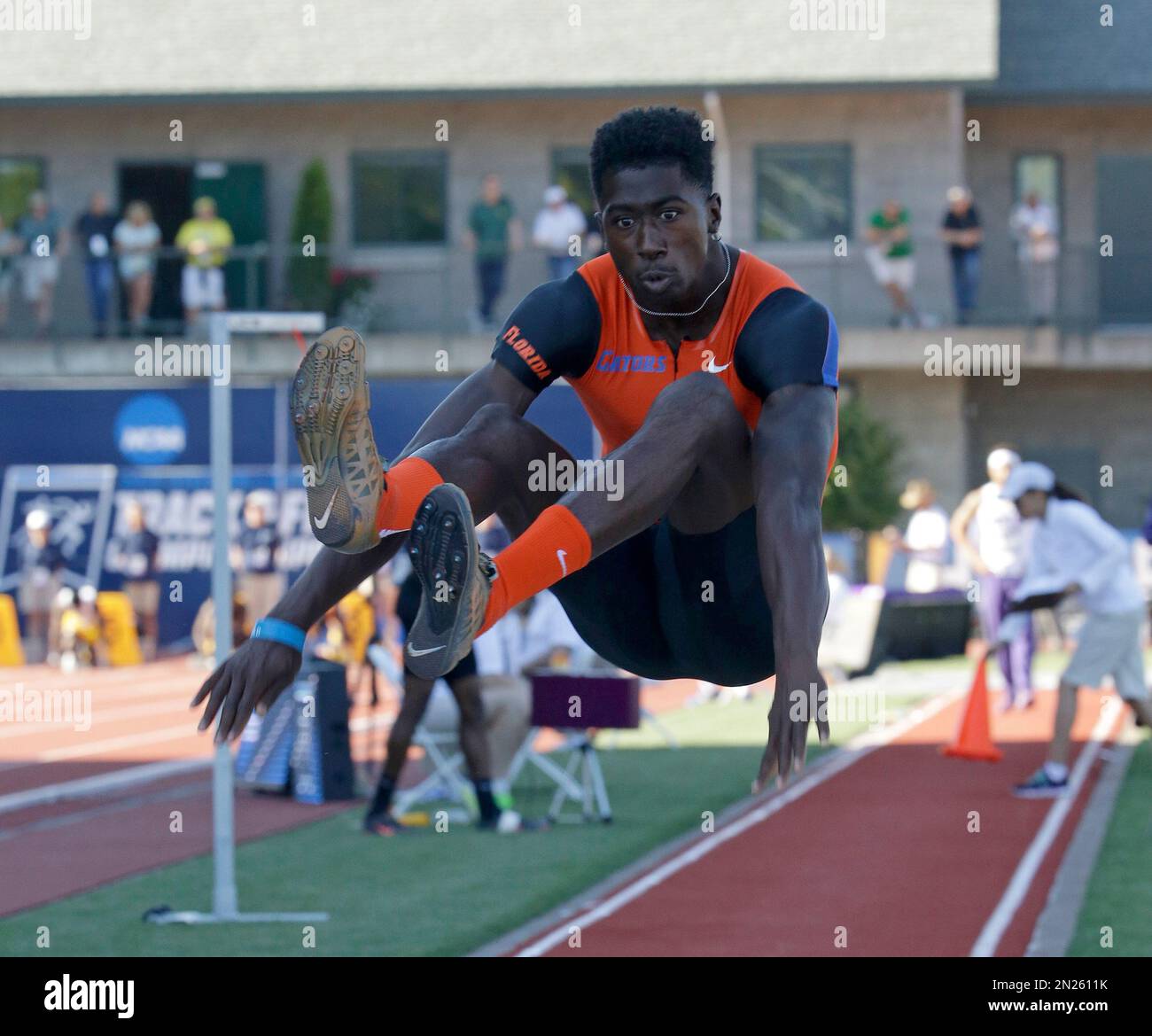 Florida's Marquis Dendy competes in the long jump during the NCAA track ...