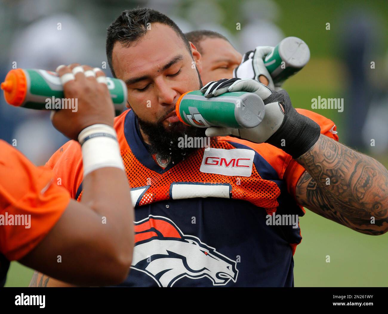 Denver Broncos tackle Louis Vasquez takes a drink during an NFL ...
