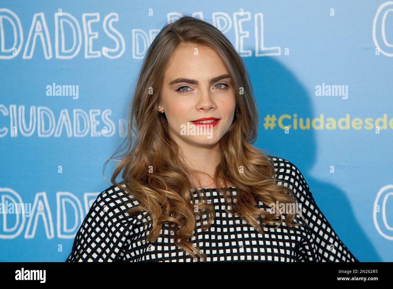 English model and actress Cara Delevingne poses for photographers ...