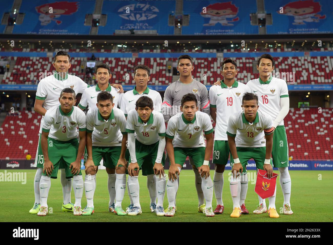 The starting line up of the Indonesian soccer team poses for a picture ...