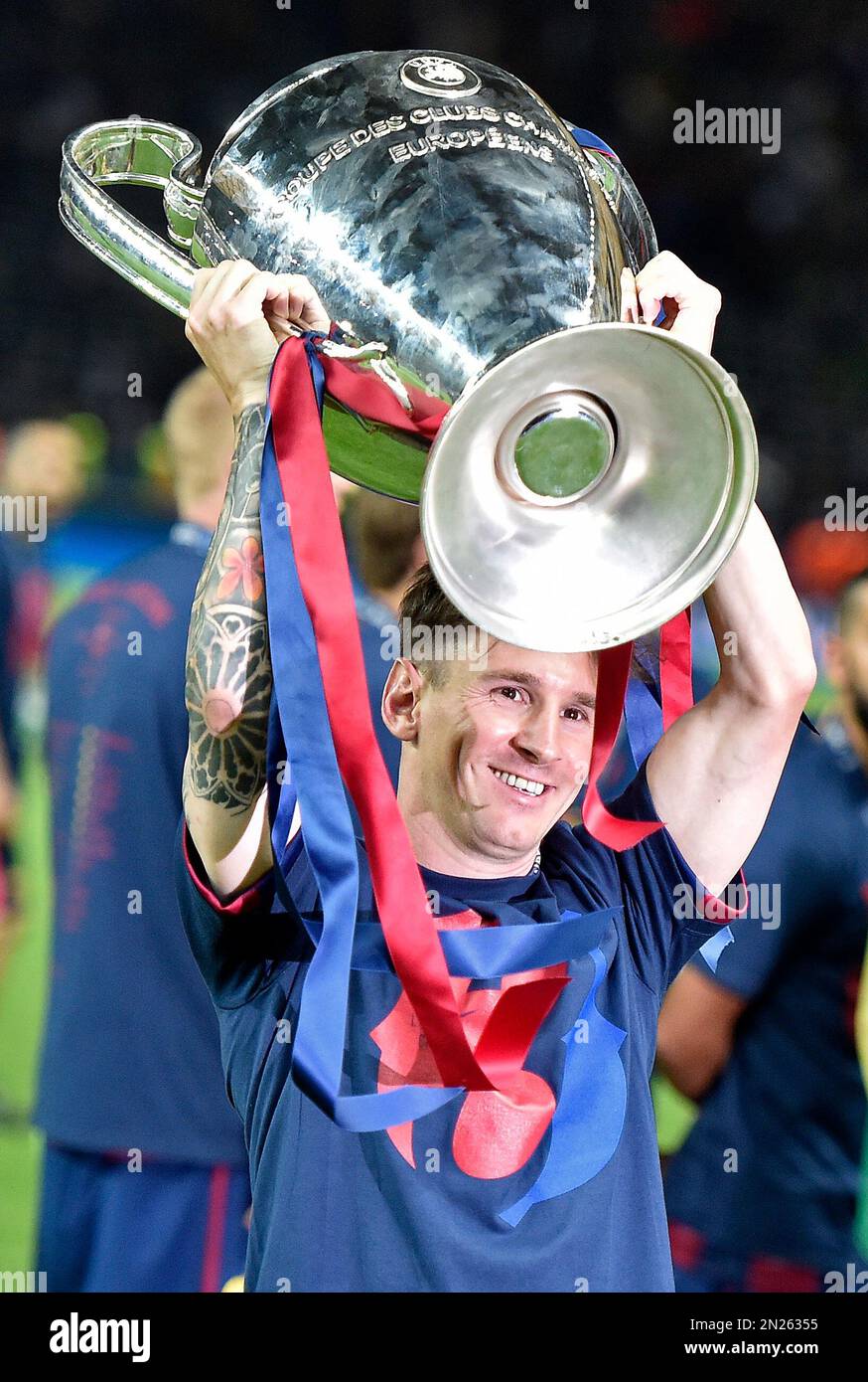Barcelona's Lionel Messi holds the trophy after winning 3-1 the ...