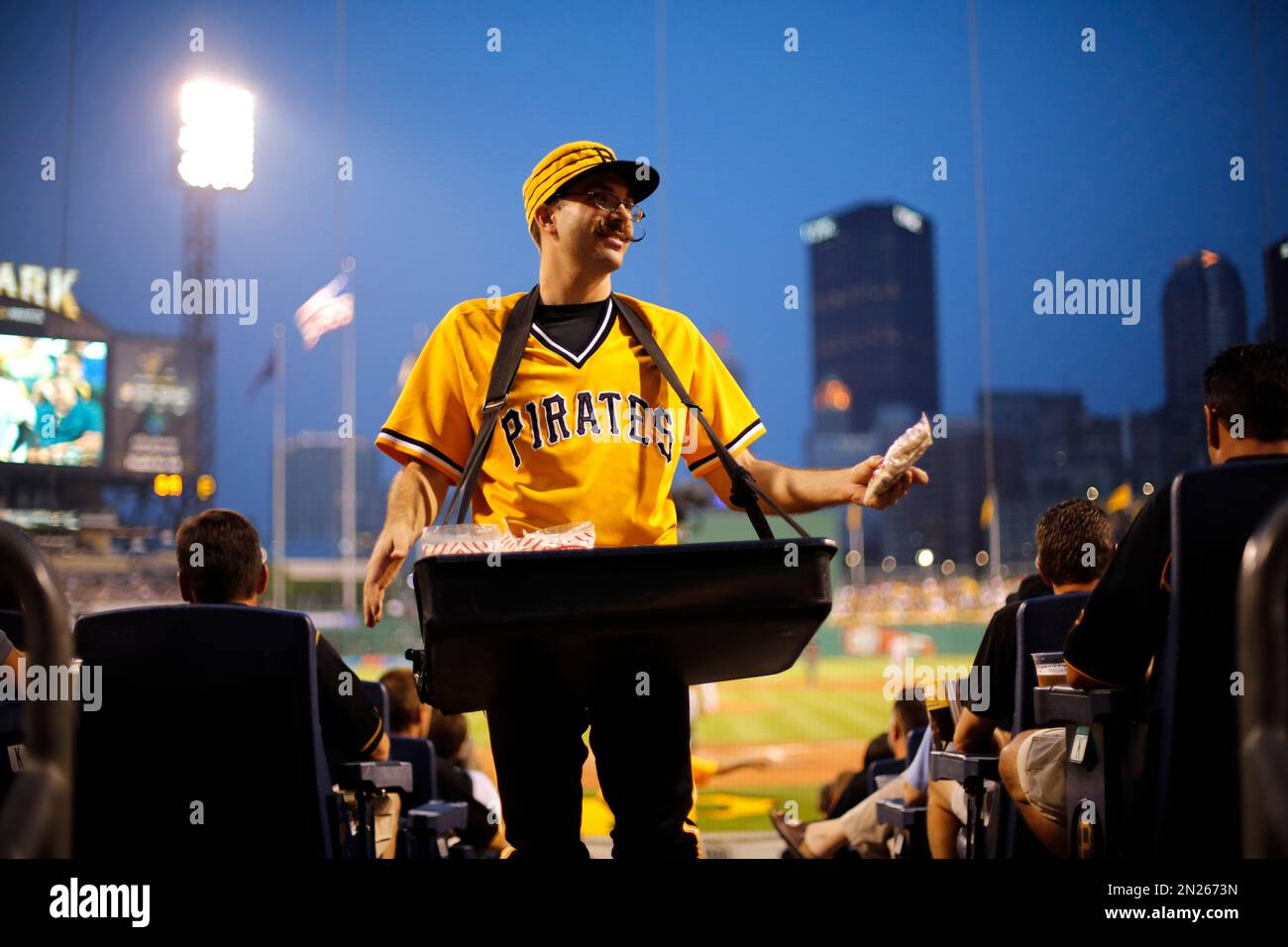 A vendor works the seats behind home plate at PNC Park during a ...