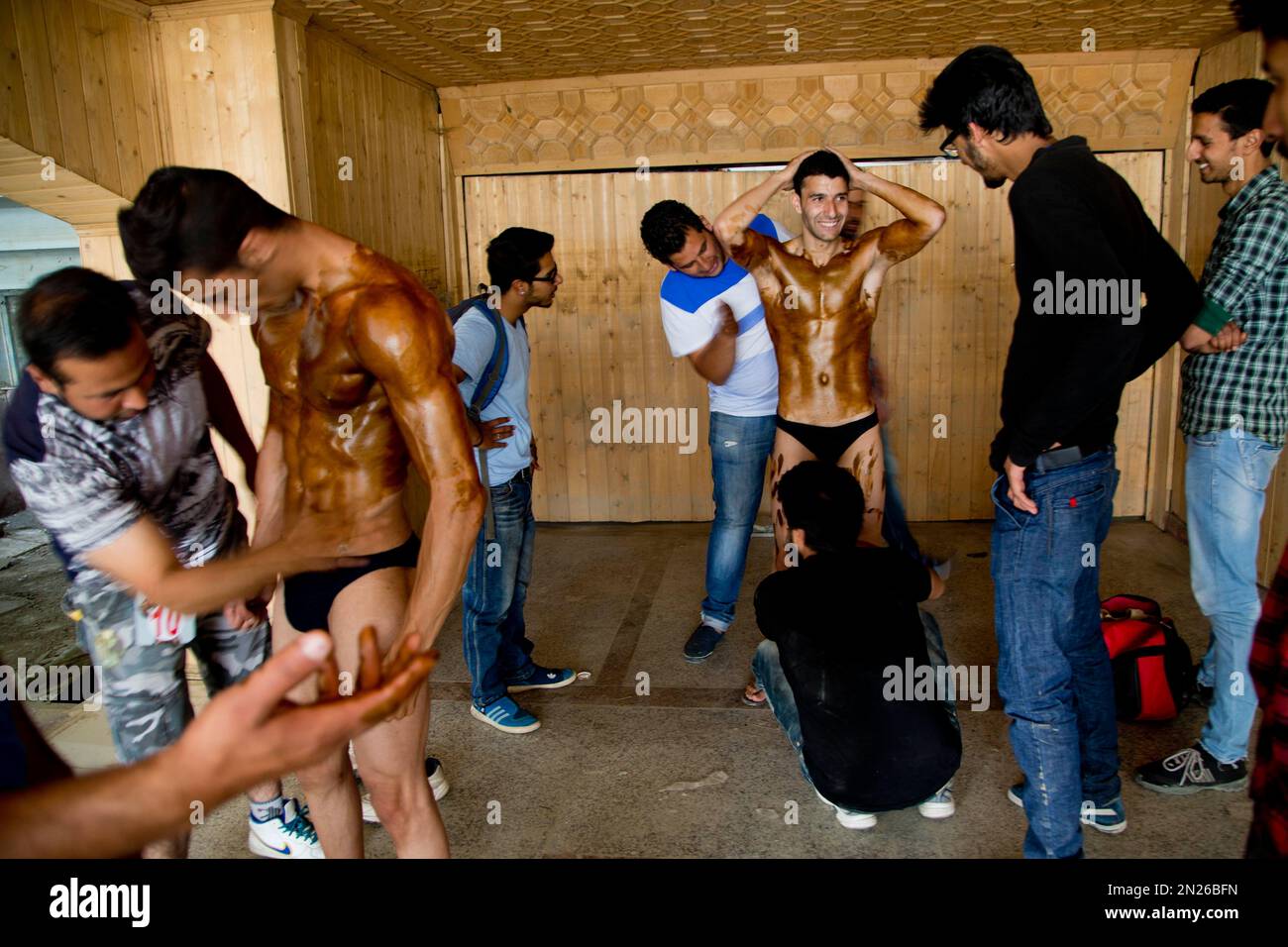 Kashmiri bodybuilders get their body tanned as they get ready for a ...