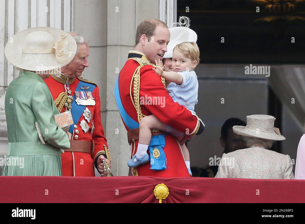 Britain's Prince William holds his son Prince George as they leave the ...