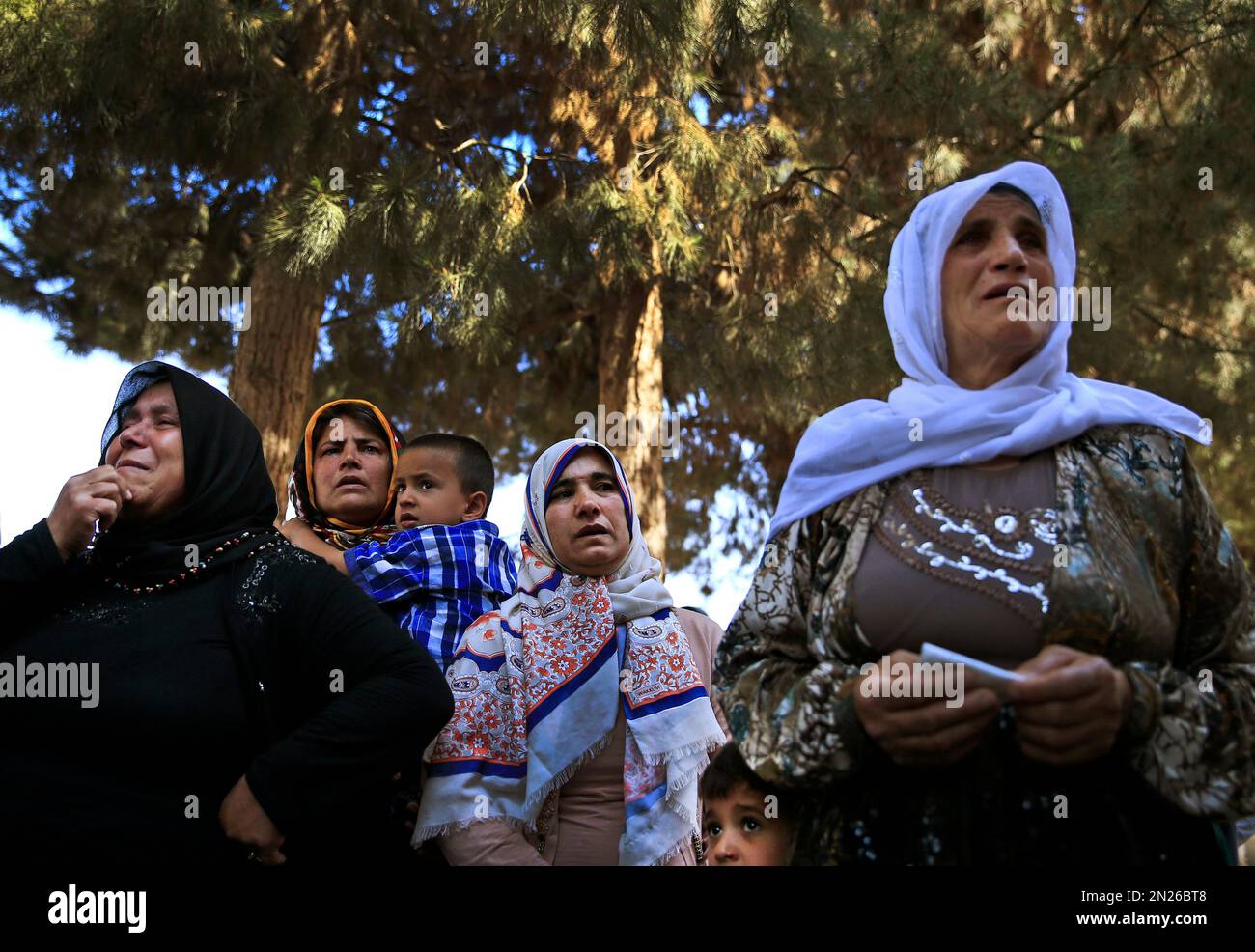Mourners watch as the coffin of Kurdish fighter Mehmet Resat Cinar ...