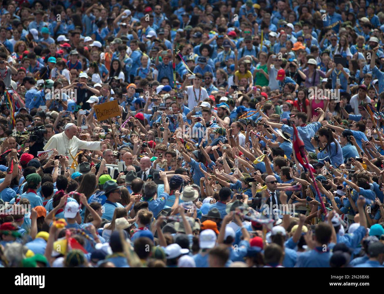 Pope Francis is cheered by the crowd as he arrives for an audience with ...