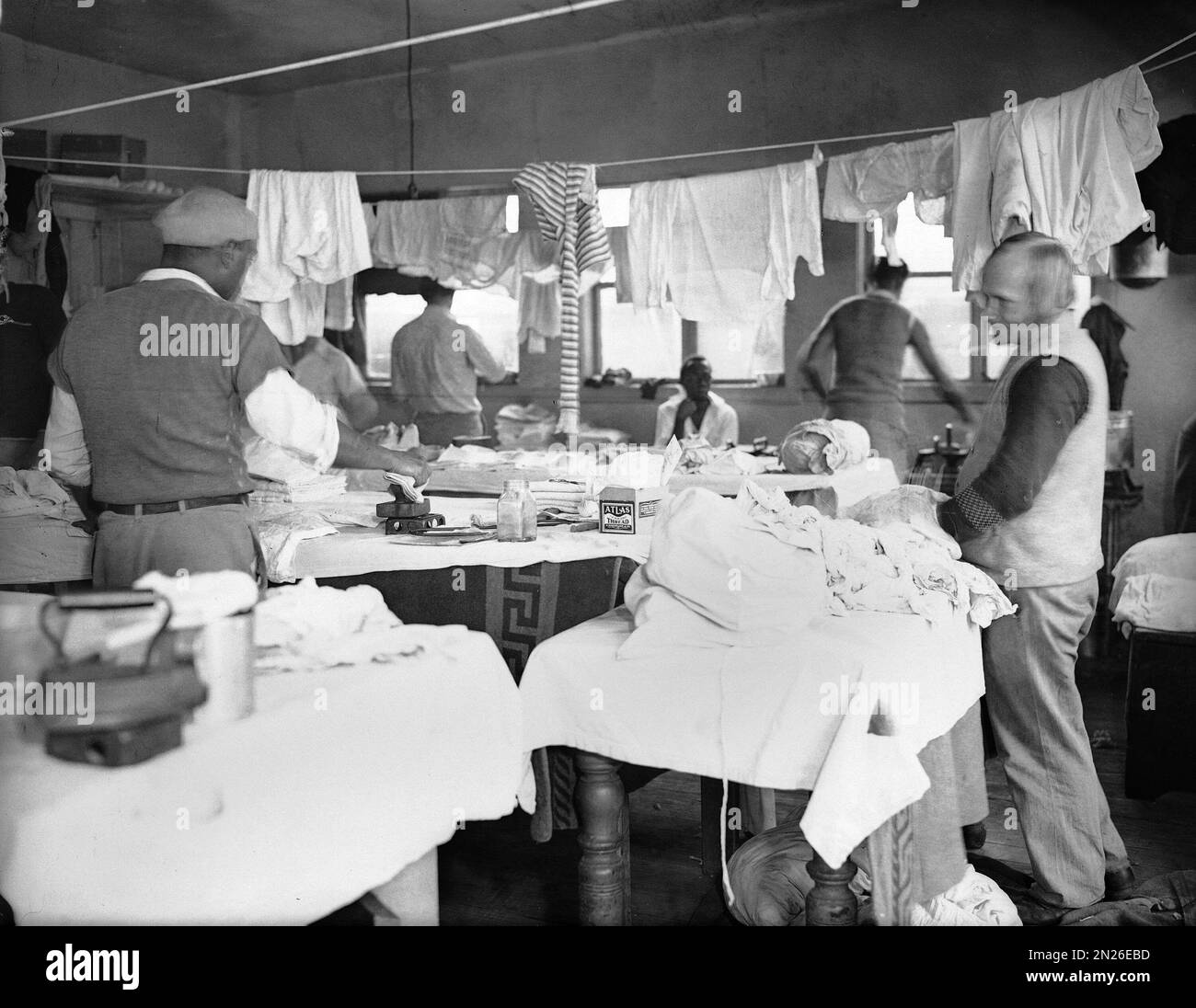 Inmates work in the laundry of the Welfare Island Penitentiary in New ...