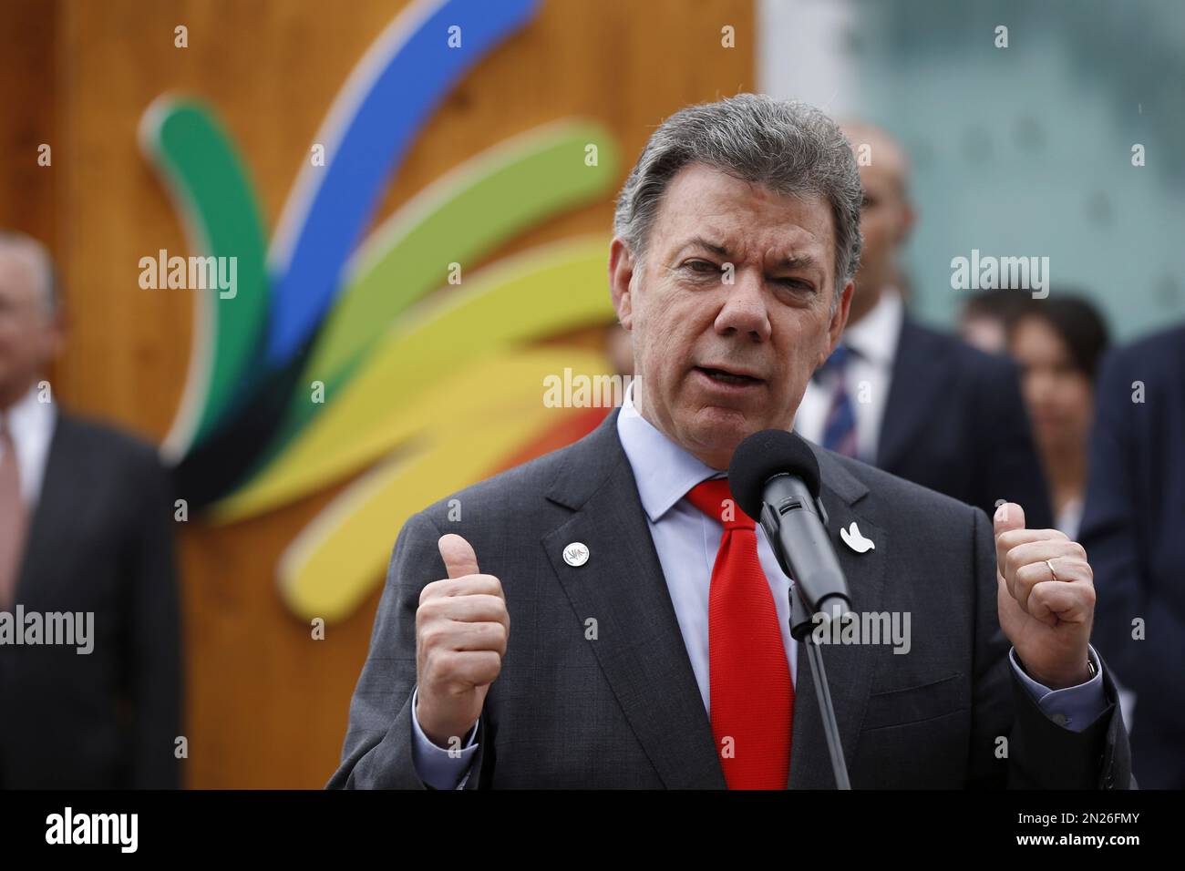 Colombia's President Juan Manuel Santos delivers his speech as he visits the Colombian pavilion ...